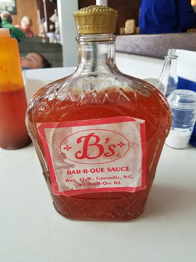 The crown jewel of Eastern Carolina&mdash;vinegar-based sauce in its natural habitat. Liquid gold for barbecue believers.