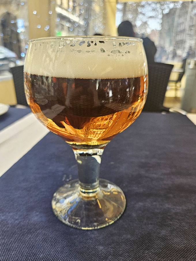 Even the beer at Dibbs comes dressed for the occasion, amber liquid catching the light like liquid sunshine in a goblet.