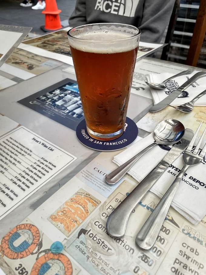 A cold beer on the paper placemat menu &ndash; the perfect companion while waiting for seafood treasures. Simple pleasures are often the most satisfying.