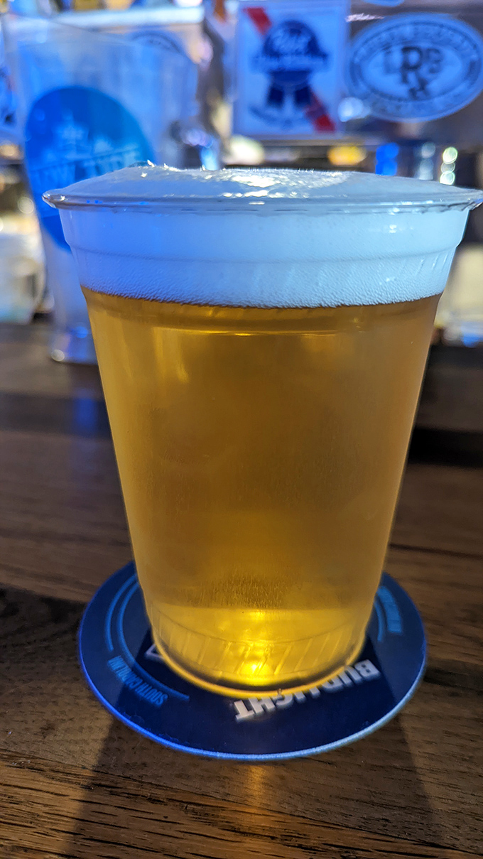 Beer so perfectly poured it deserves its own moment of silence. In a plastic cup, because Nu-Way knows pretension is the enemy of enjoyment.