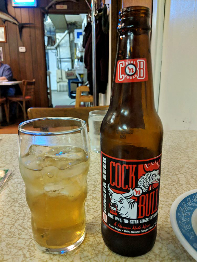Nothing complements fried fish like a cold Cock 'n Bull ginger beer—the spicy kick cuts through richness like a well-timed punchline.