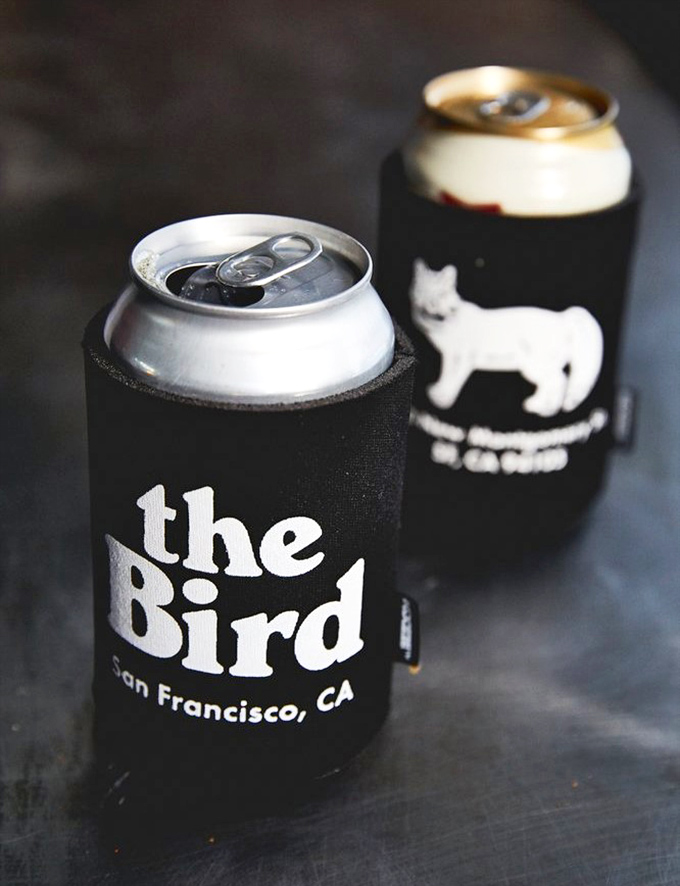 Even the beer koozies at The Bird have personality. These aren't just drink holders; they're tiny billboards announcing your excellent taste in fried chicken establishments.