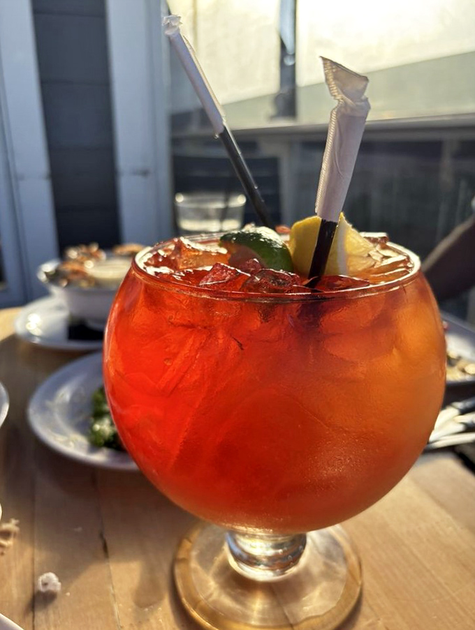 That's not just a cocktail, it's a sunset in a glass! This vibrant concoction promises vacation vibes with every sip.