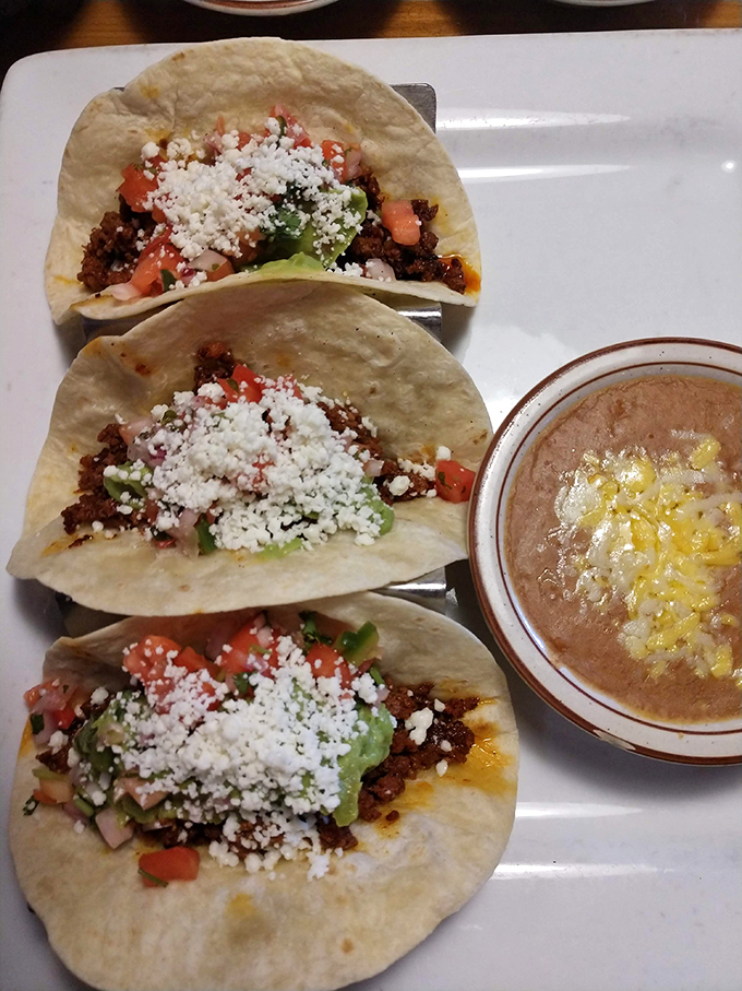 Birria tacos with that perfect cheese pull, served with consommé for dipping – like French dip sandwiches that went on a life-changing trip to Mexico.