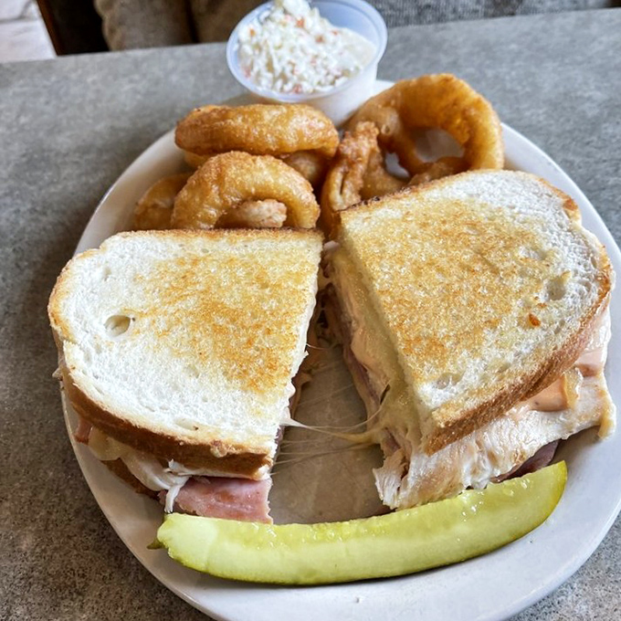 A sandwich that requires both hands and a strategy. Those onion rings aren't garnish&mdash;they're the perfect crunchy sidekick to this flavor bomb.