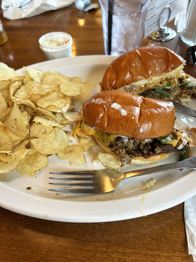 Burgers here aren't afterthoughts &ndash; this hearty creation comes loaded with melted cheese and fresh toppings, accompanied by perfectly crisp potato chips.