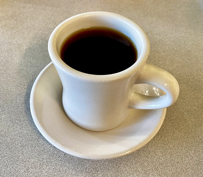The humble diner coffee &ndash; consistently hot, reassuringly strong, and more reliable than most relationships. No fancy foam art needed.