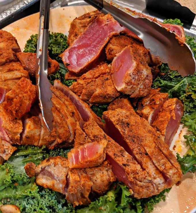 Blackened tuna that walks the perfect line between rare and seared, nestled on a bed of greens. The spice rub creates a passport to flavor country.