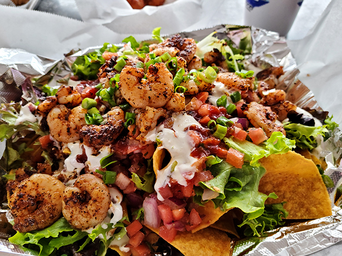 Blackened shrimp nachos that blur the line between Florida and Mexico in the most delicious cultural exchange program ever. Spice, crunch, and seafood in perfect harmony.