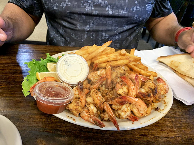 Blackened shrimp that dance with spices without being overwhelmed by them. The fries are there to cool your taste buds between bites.