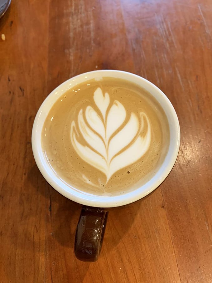 Latte art so pretty you almost don't want to drink it. Almost. That leaf design is practically begging for an Instagram moment.