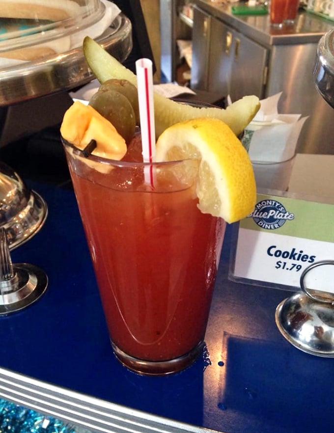 The Bloody Mary arrives like a garden in a glass, garnished with enough pickles and cheese to count as an appetizer. Sunday morning salvation.