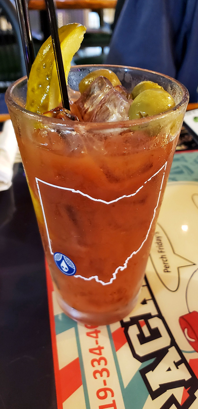A Bloody Mary garnished with pickles and sporting the outline of Ohio—because drinking should always come with state pride.