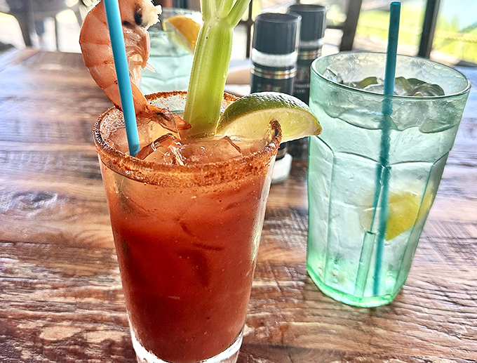 The Bloody Mary comes with a shrimp on vacation, while its neighbor keeps it simple with lemon. Breakfast of champions, Florida-style.