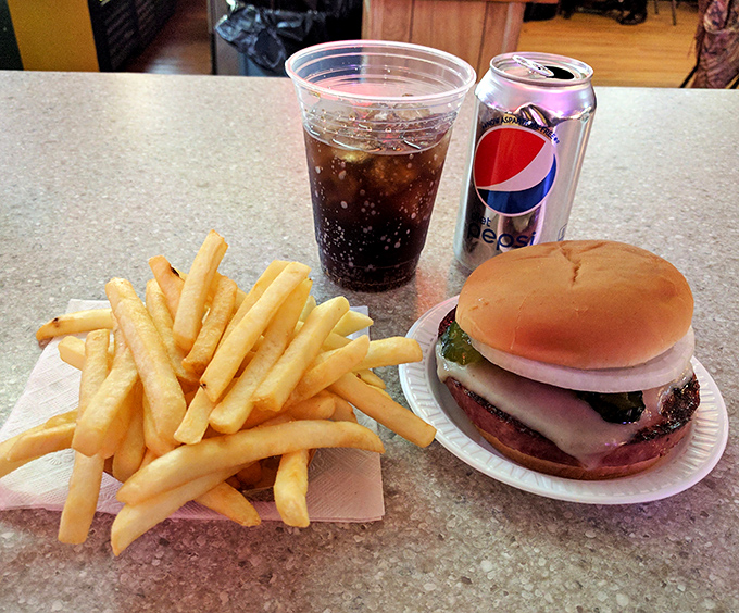 The classic combo: a perfect burger, golden fries, and an ice-cold soda. Sometimes the simplest pleasures are the most satisfying, especially after a long drive.