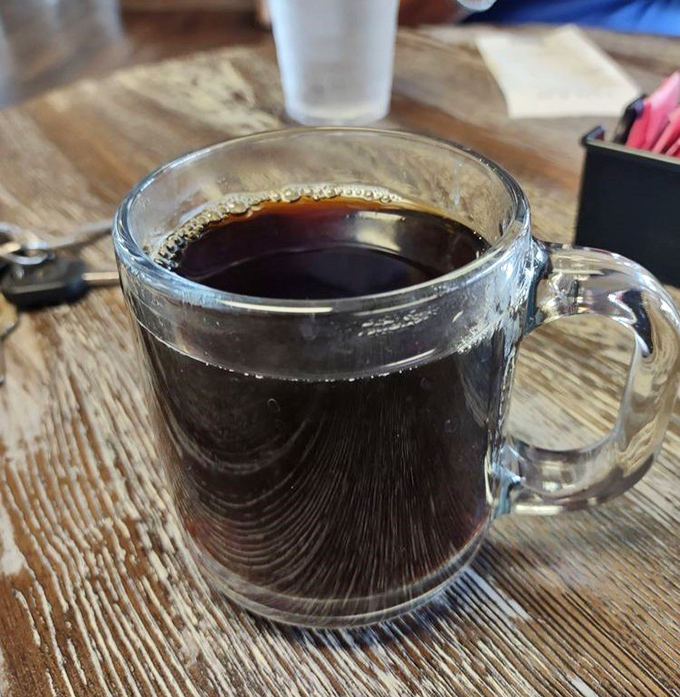 Coffee served in a clear mug &ndash; because when it's this good, you want to see what you're drinking. The perfect bitter companion to sweet pie indulgence.