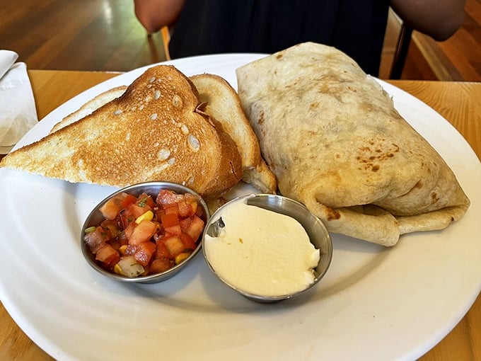 Breakfast's greatest hits album: golden toast, a burrito plump with promise, and those little cups of salsa and cream ready for their supporting roles.