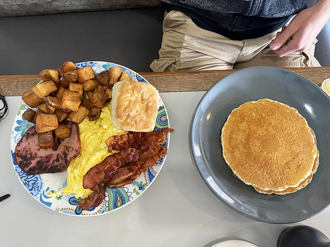 A breakfast platter that means business&mdash;golden home fries, farm-fresh eggs, crispy bacon, and a biscuit that could make your grandma jealous.