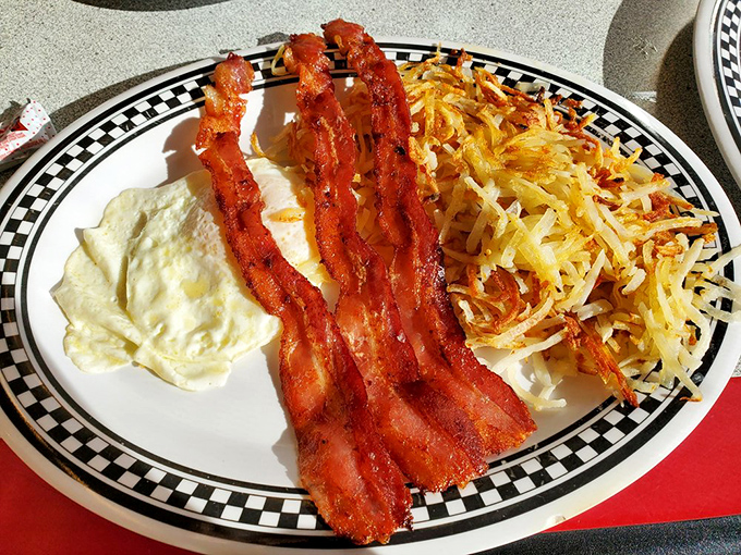 The breakfast trinity&mdash;perfectly cooked eggs, bacon with just the right crispness, and hash browns that crackle with each bite.