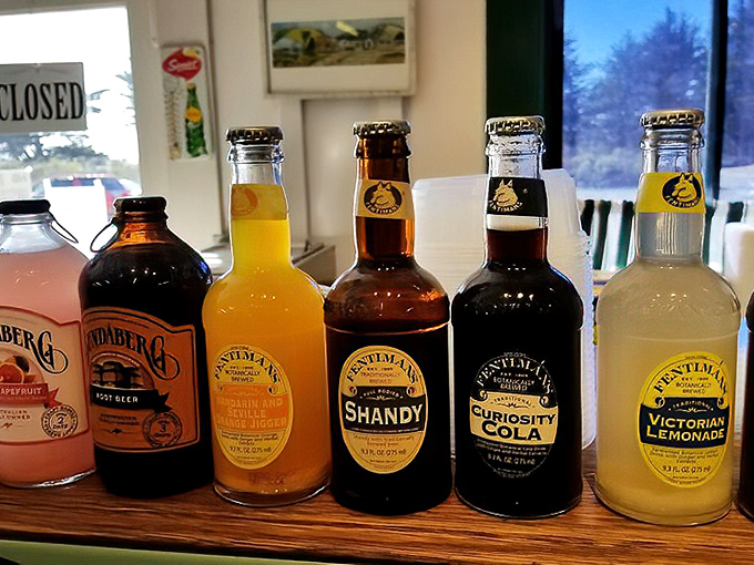 Local craft sodas line the shelves, offering unique flavors that pair perfectly with any sandwich choice from the deli.