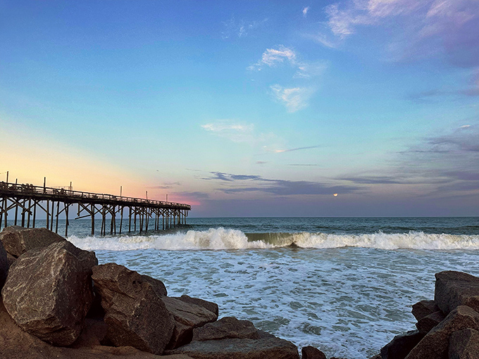 Where engineering meets endless summer. The pier stretches toward the horizon like a concrete invitation to adventure.