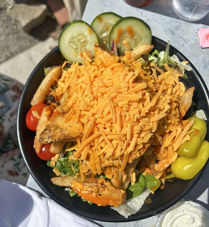 This salad isn't apologizing for anything. Topped with enough cheese to make Wisconsin proud and vegetables playing supporting roles to the crispy chicken star.