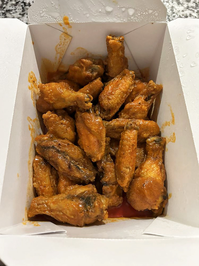 To-go wings that won't actually make it home. The car will smell amazing, but these saucy delights are destined for immediate consumption.