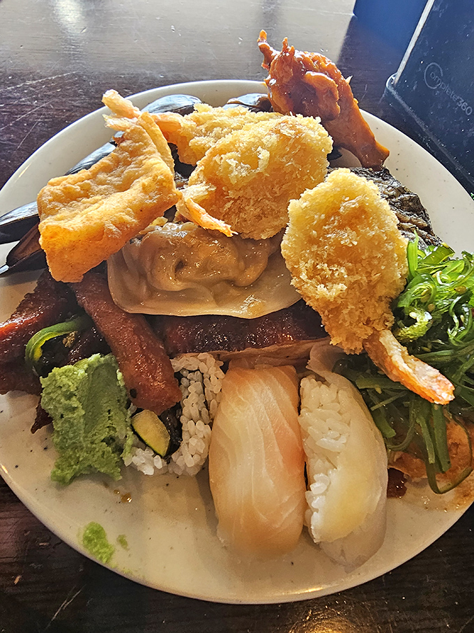 A masterclass in buffet strategy: this plate demonstrates the delicate art of maximizing variety while maintaining enough real estate for dessert later.