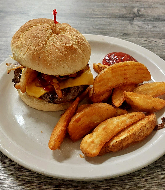 A burger that means business, with potato wedges that could make a grown person weep with joy.