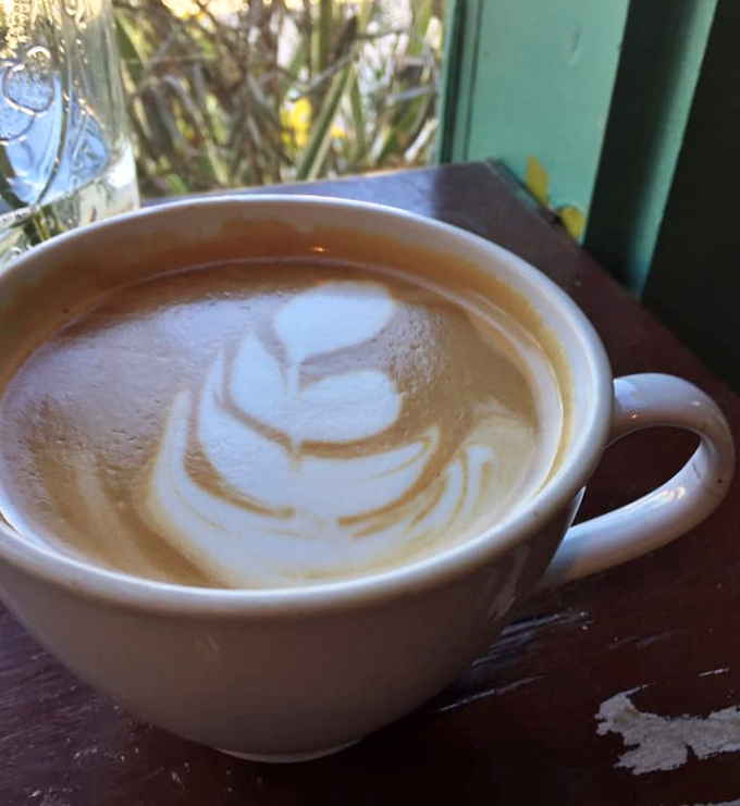 Coffee art that says, "We care enough to make your caffeine pretty." The leaf design isn't just milk foam&mdash;it's the morning's first smile.