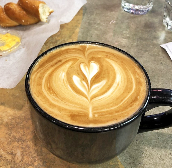 Latte art so pretty you almost don't want to drink it. Almost. That heart is saying "resistance is futile."