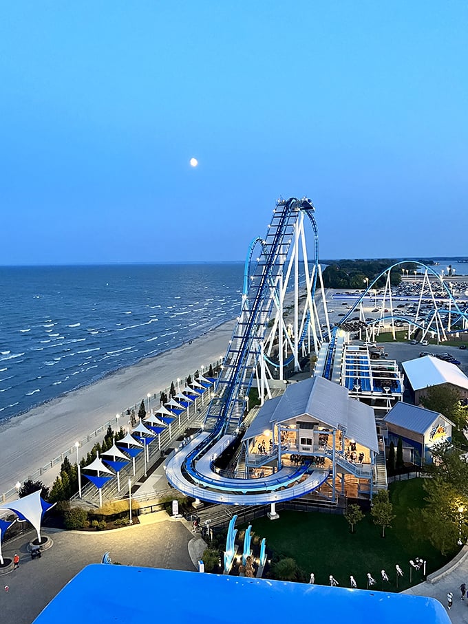 The moon rises over Lake Erie as Cedar Point's coasters cut dramatic silhouettes &ndash; a spectacular view worth the short drive from Ada.