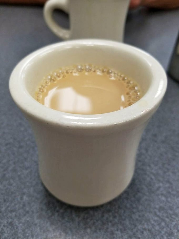 The coffee comes in these sturdy white mugs that say, "Don't worry, I've got enough caffeine to get you through whatever today brings."