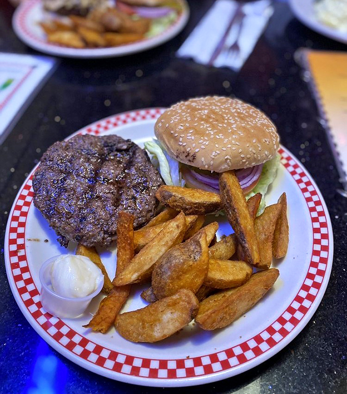 A proper diner burger doesn't need truffle aioli or fancy names&mdash;just honest beef, proper toppings, and fries that could stand alone as a meal.