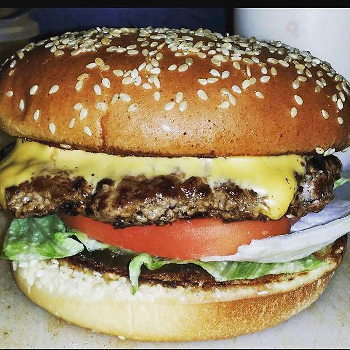 The classic American cheeseburger, executed with such precision it reminds you why this became a national treasure in the first place.