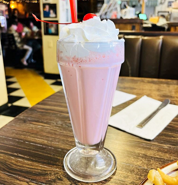 This isn't just a milkshake&mdash;it's a pink cloud in a glass topped with enough whipped cream to make Elvis say "thank you, thank you very much."