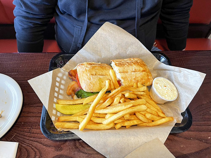 This chicken ciabatta sandwich arrives like a warm hug wrapped in toasted bread, proving simple ingredients create extraordinary magic.