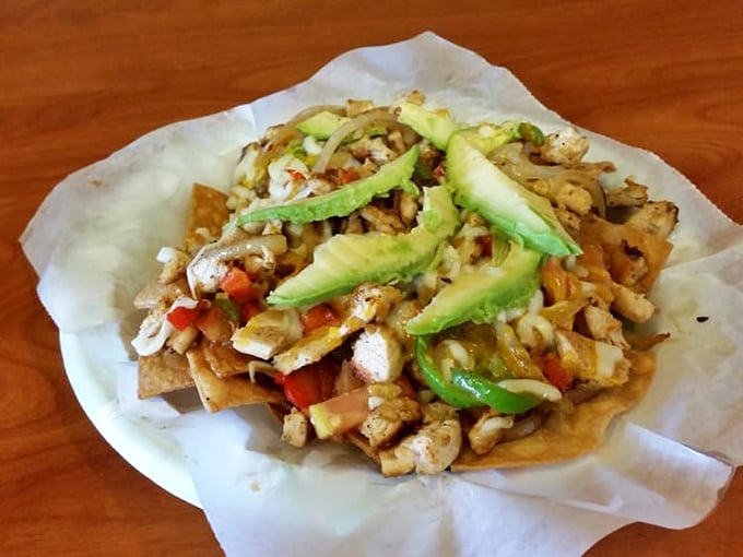 Nachos that refuse to be an afterthought. Fresh avocado, seasoned chicken, and enough toppings to make every chip a treasure hunt.