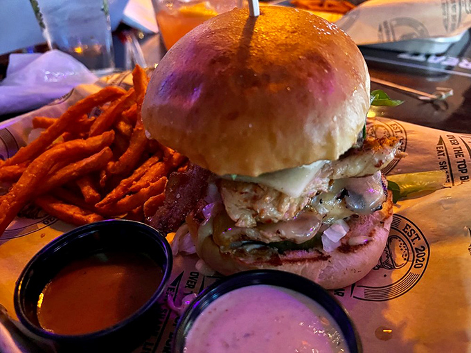 A tower of temptation that requires both hands, multiple napkins, and possibly a signed liability waiver before consumption.