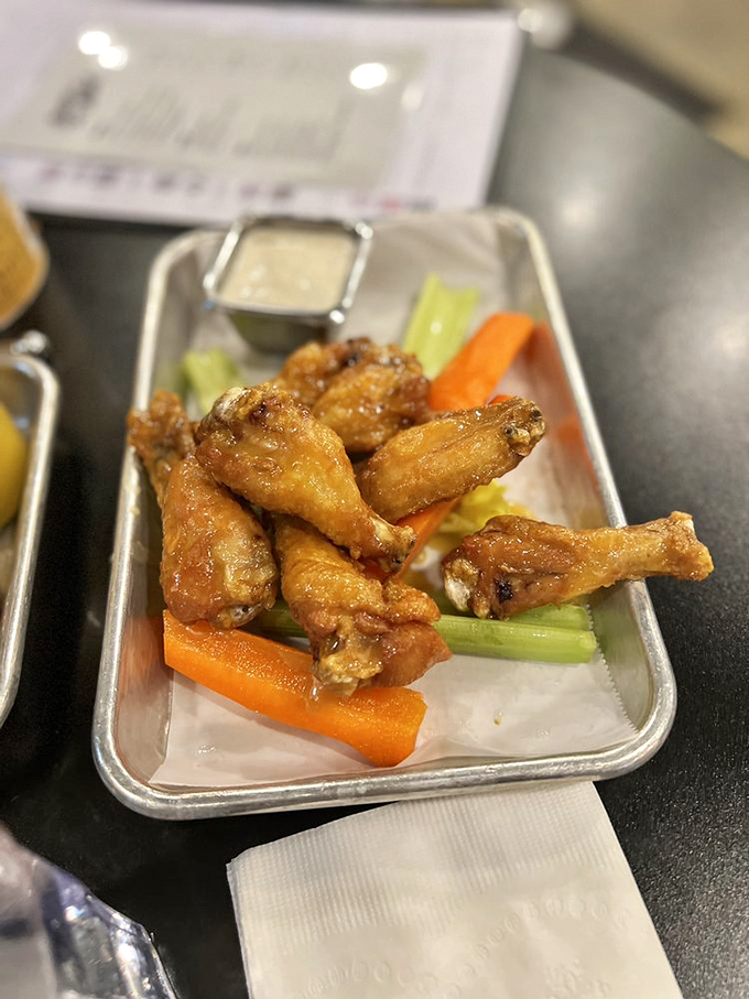 These aren't just wings; they're the reason napkins were invented. Crispy, saucy, and unapologetically messy in all the right ways.