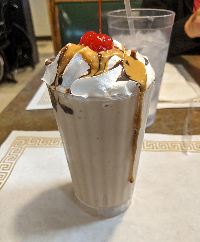 This chocolate brownie milkshake isn't just a dessert, it's a commitment - topped with enough whipped cream to make a dairy cow blush.