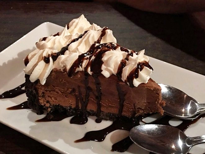 Chocolate cake that makes you consider ordering dessert first, because life is uncertain and calories don't count when something tastes this good.