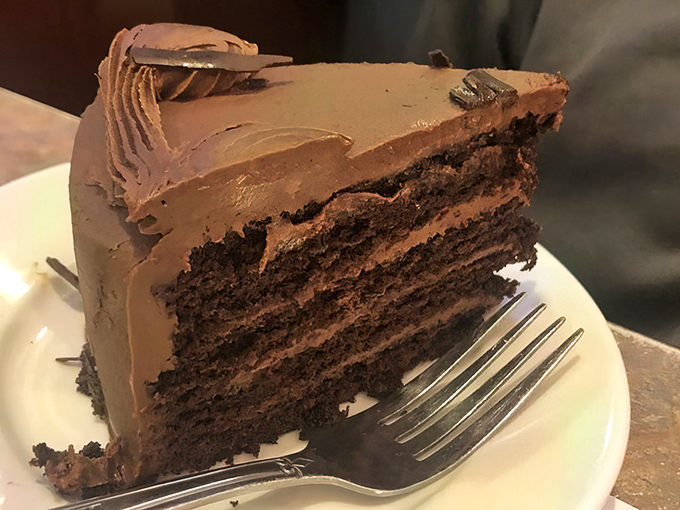 Layer upon layer of chocolate decadence that makes you wonder if calories consumed while sitting in vinyl booths actually count.