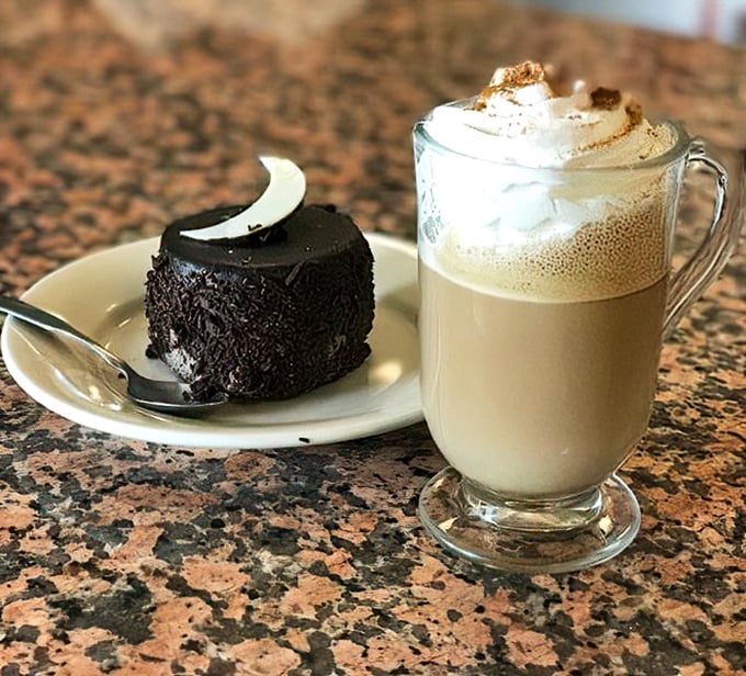 That chocolate cake looks like it's auditioning for a dessert calendar, while the coffee stands by ready to cut through the richness.