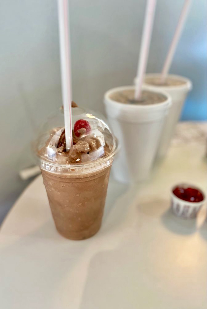 Rich chocolate milkshake topped with whipped cream proves some pleasures never go out of style.