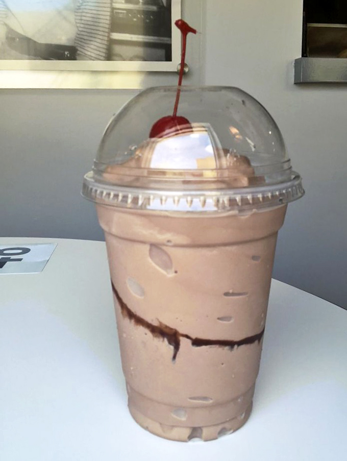 The chocolate milkshake comes crowned with a cherry, thick enough to require a spoon first&mdash;dessert masquerading as a beverage. 