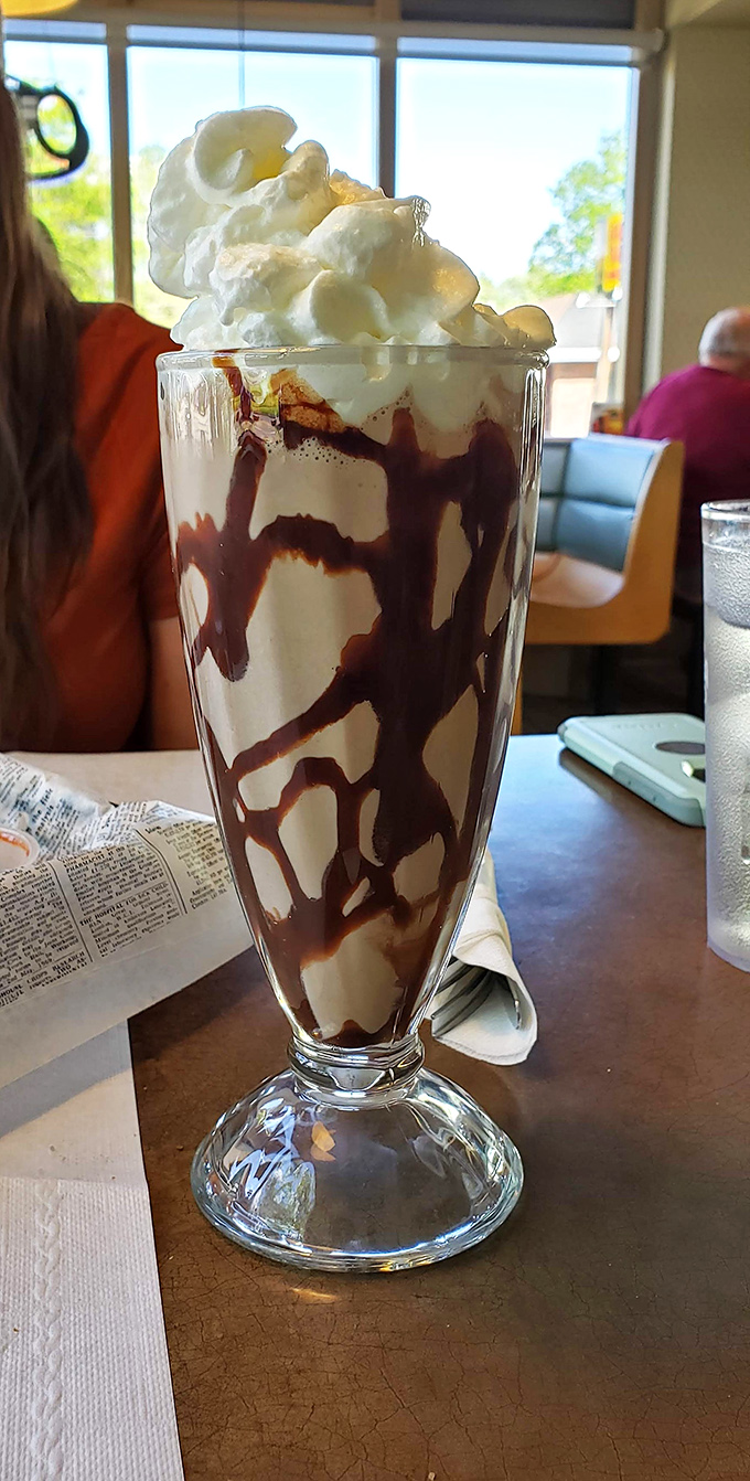 This chocolate milkshake isn't just a drink, it's architecture &ndash; layers of chocolate and cream building toward a whipped cream summit that demands respect.