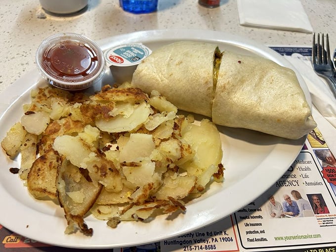 Breakfast burritos: where morning meets afternoon in a tortilla time machine. This one's stuffed with enough fillings to fuel your entire day.
