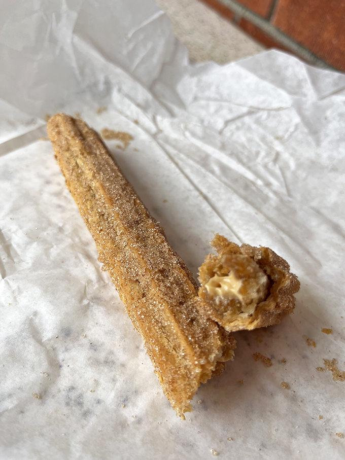 The churro&mdash;cinnamon-sugar coated happiness in stick form. Crispy outside, soft inside, with cream filling that makes you question all other desserts.