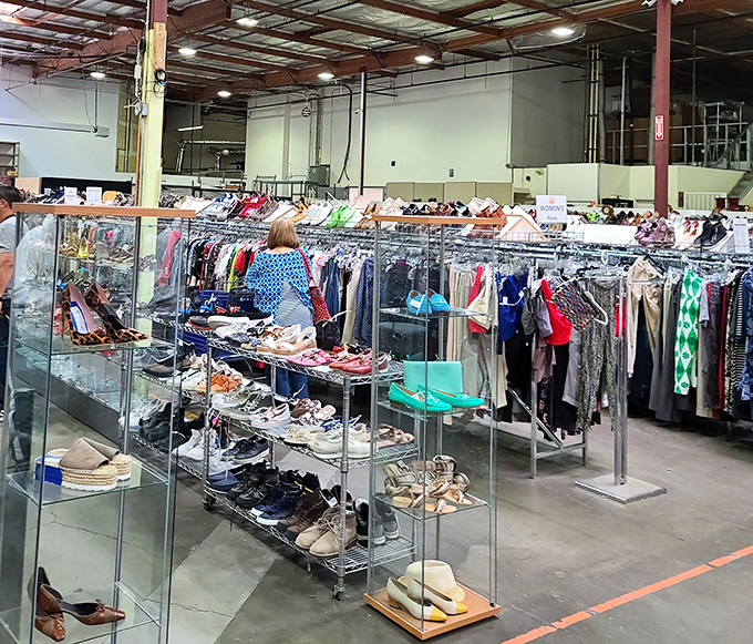 The shoe and clothing section is meticulously organized with metal racks gleaming under warehouse lights. Marie Kondo would definitely spark joy here.